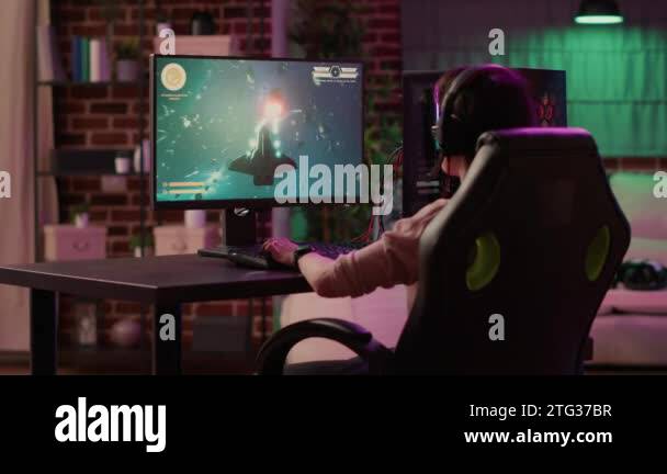 Over shoulder view of gamer girl relaxing and streaming on internet ...