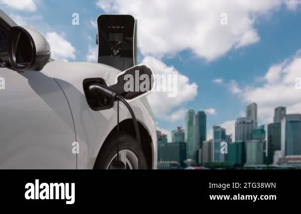 Electric vehicle, EV car recharges battery energy at charging station ...
