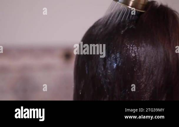 Back View Of Young Brunette Woman Taking Shower In Bathroom Washing