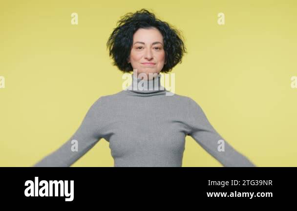 Confident positive mature woman 40s showing You Can Do It gesture ...