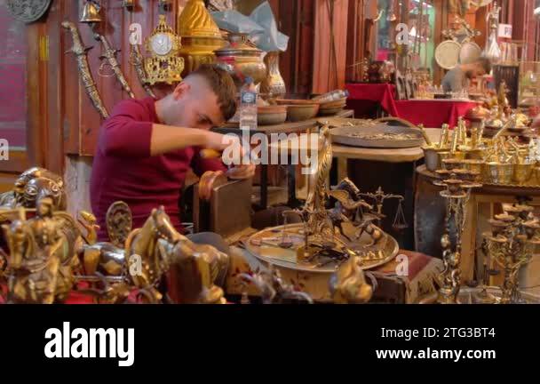 Gaziantep, Turkey - October 25, 2021: Copper master, craftsman at work in traditional workshop ...