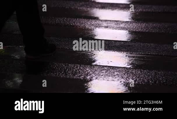 Body parts of walking people on the street in Shinjuku at night rainy day handheld Stock Video ...