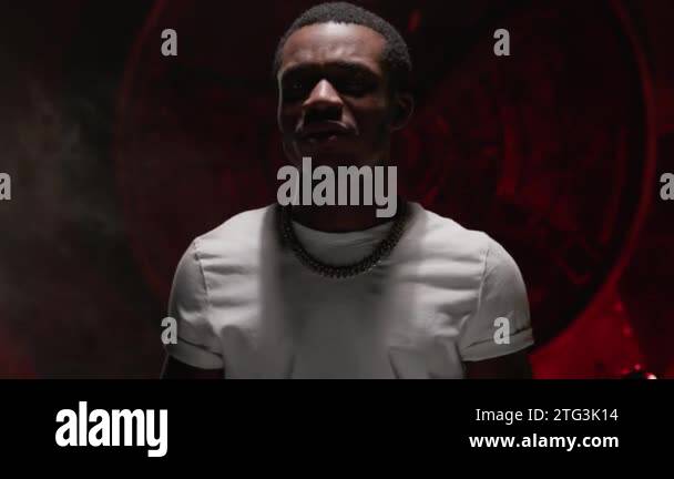 Portrait black African American man hip hop singer singing rap song in ...