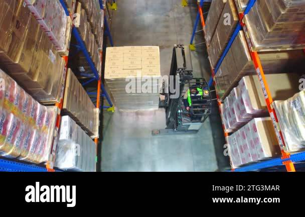 Modern forklift in a warehouse. Workflow in a modern warehouse. Large ...