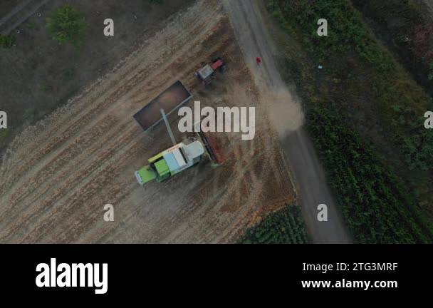 Combine harvester unloading wheat trailer Stock Videos & Footage - HD ...
