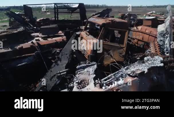 Destroyed military convoy. Burnt combat vehicles. Rusty tech ...