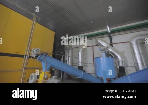 Wood waste oven. Modern recycling furnace. Boiler room. Inside a modern ...