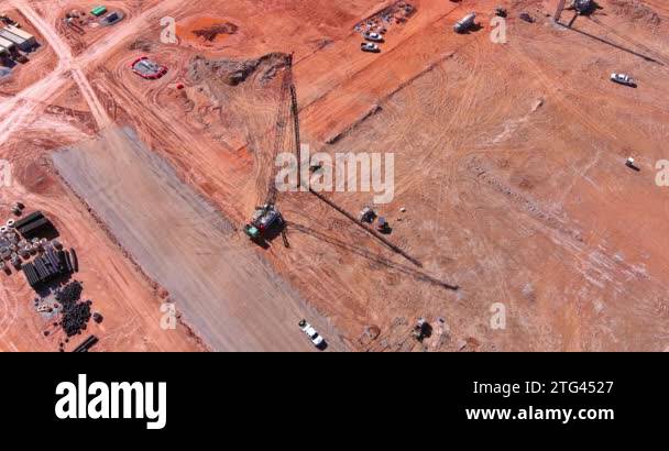 Construction site truck mounted pump pumping concrete sweat earth under ...