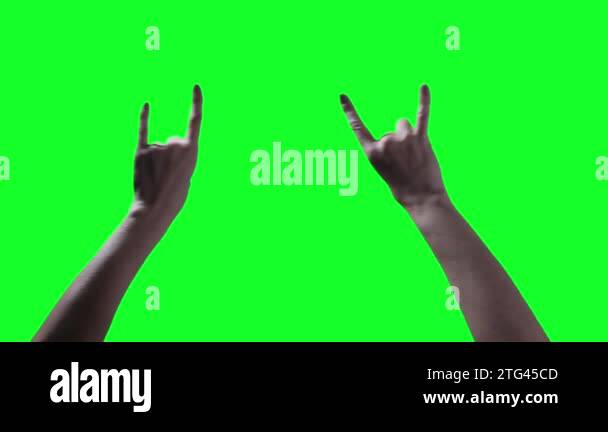 Devil Hand Sign Gesture against Green Background. Woman Making the ...