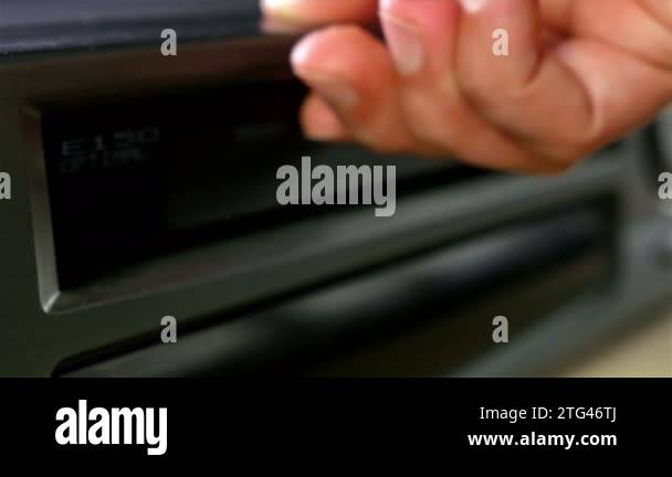 Inserting a VHS Tape into a VCR Player Stock Video Footage - Alamy