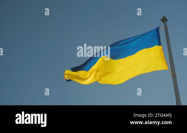 Slow motion of Ukraine flag waving background sky blue and yellow ...