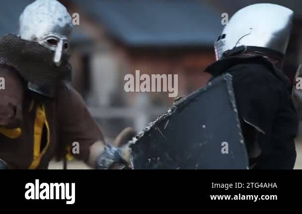 Terrible struggle between medieval knights in armor at the main city ...