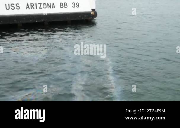 uss arizona and an oil sheen on the surface Stock Video Footage - Alamy