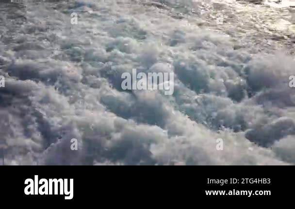 Blue ocean sea water wave with fast yacht boat wake foam of prop wash ...