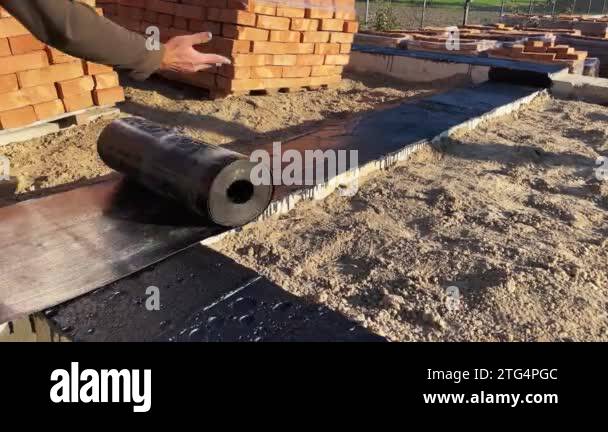 Roll waterproofing of the foundation of the building before the start ...