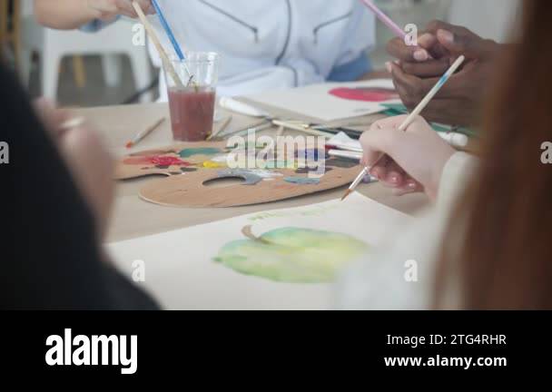 Closeup group of student sitting and studying and learning drawing with ...