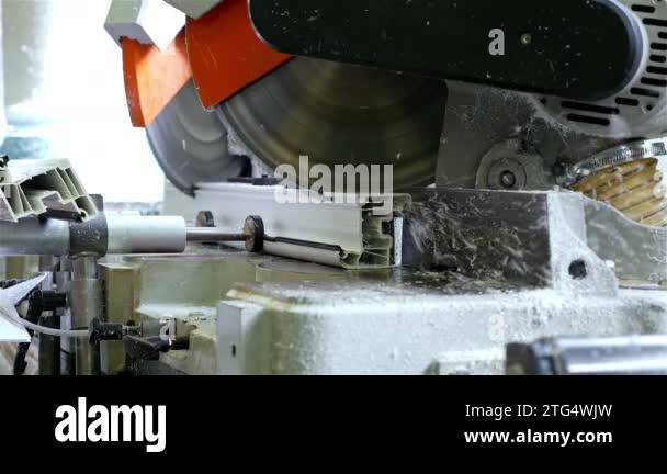 Cutting PVC profile with circular saw, plastic windows manufacture ...