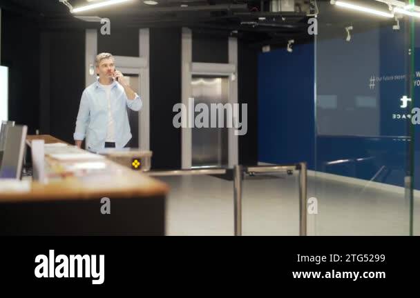 Man worker walks through a Automatic security turnstile station in ...