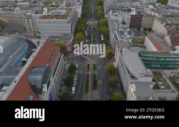 High angle view of wide straight street lined by trees in urban borough ...
