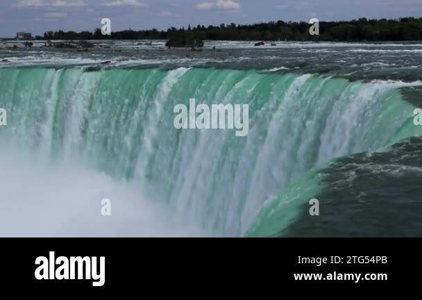 The edge of the waterfall - water flows into a cliff - a strong flow of ...