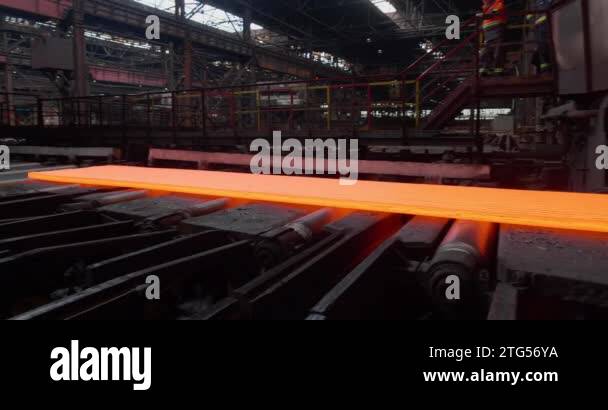 A split steel billet moves along the conveyor. Metallurgical plant ...