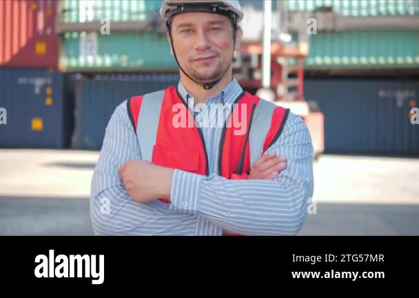 Handsome and happy professional engineers worker wearing safety vest ...