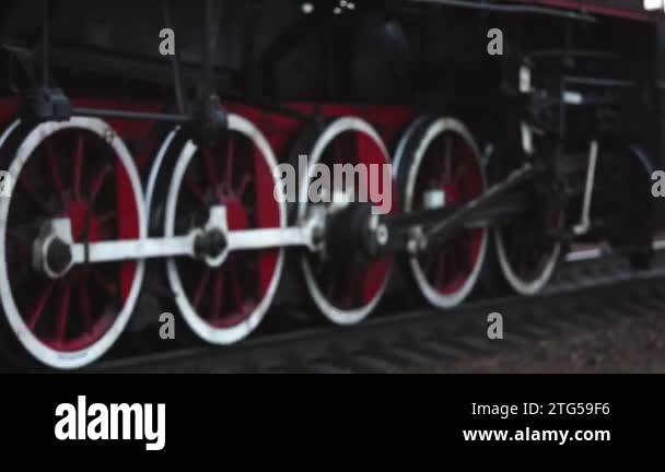 Locomotive rolls along. Grunge old steam diesel wheel and rods. Steam ...