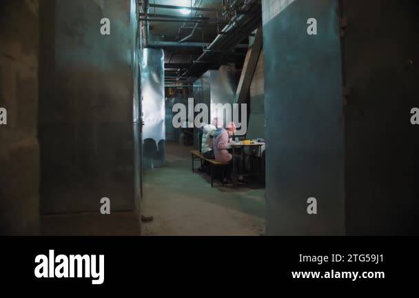 War in Ukraine. Bomb shelter. Children are hiding in shelter in the ...