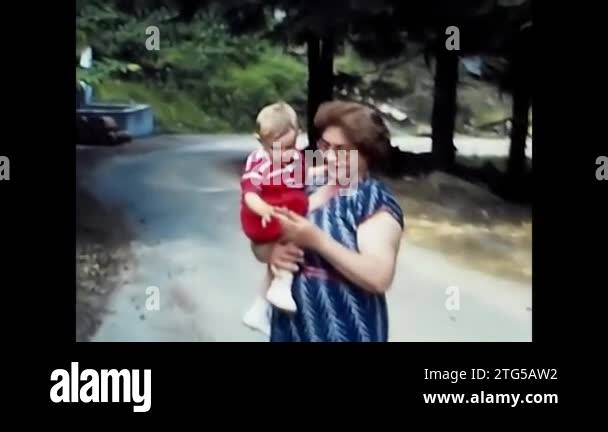 trasquera, italy june 14 1980:woman with small child on holiday in the ...