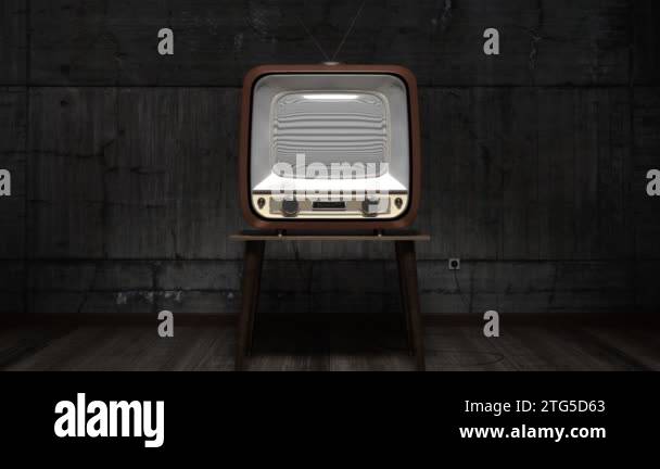 Retro TV receiver with green screen standing on a table, concrete wall ...