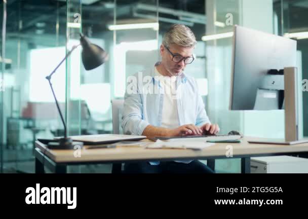 Mature Employee job done Satisfied office worker leaning back ...