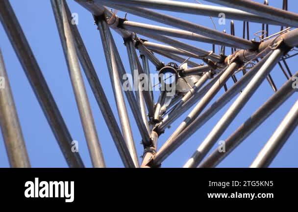 Zooming of Steel Triangle Tower for Wind Turbine. Look from the bottom ...