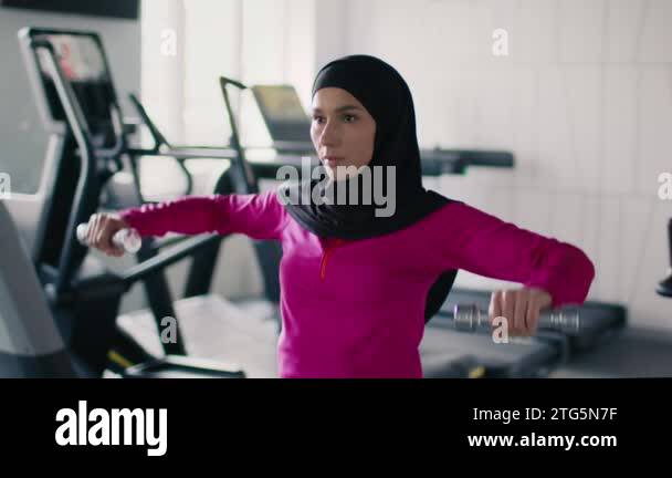 Sport training for muslim ladies. Young active middle eastern woman in ...