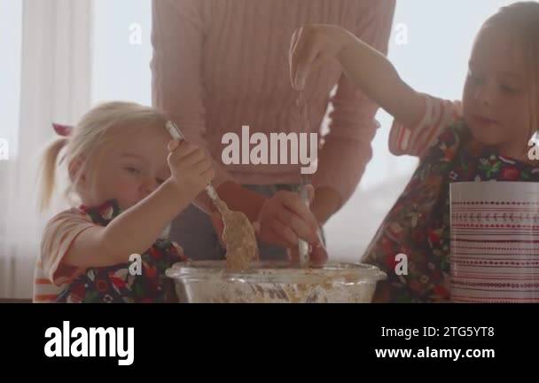 Children mixing ingredients together home Stock Videos & Footage - HD ...