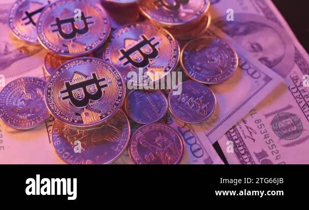 Bitcoin coins on US Dollar banknotes and coins, investing in crypto ...