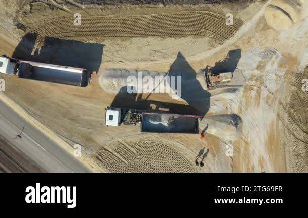 Above top view, overhead on tipper truck as lifting his trailer to ...