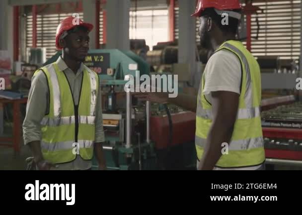 Two America worker black man wearing safety uniform with hardhat hand ...