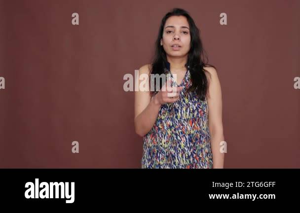 Indian person making hush gesture with index finger over lips Stock ...