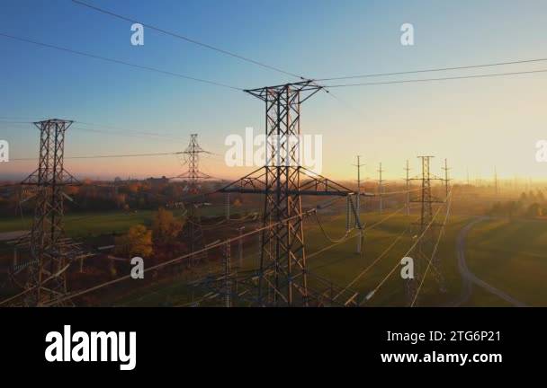 Transmission power tower with wires at golden hour. Electricity pylon ...