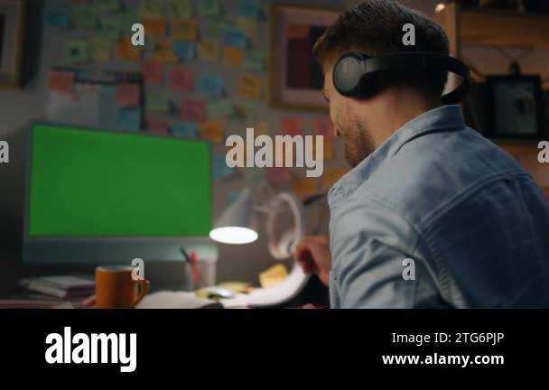 Pleasant man enjoying music at home closeup. Positive freelancer ...