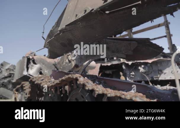 Burnt military equipment after a missile attack. Abandoned rusty military equipment. City of ...