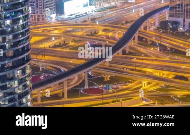 Highway intersection and overpass of Dubai downtown aerial night ...