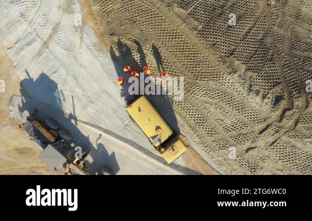 Above top view, dolly move overhead upward on team with supervisor ... Above top view, dolly move overhead upward on team with supervisor ...