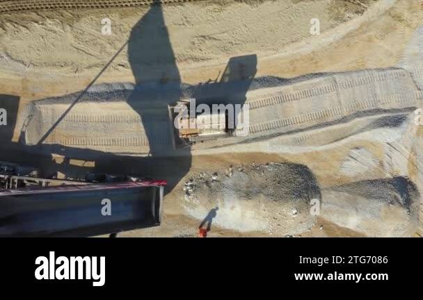 Above top view, overhead on tipper truck as lifting his trailer to ...