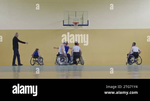 Wheelchair Basketball Game: Players Compete, Dribbling Ball, Passing ...