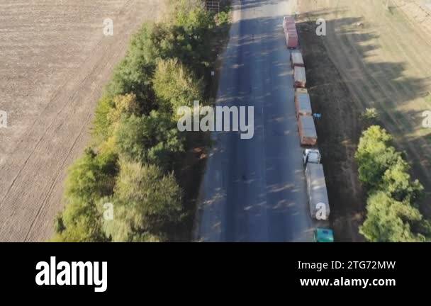 grain delivery. Grain storage. Grain trucks stand along the road in ...