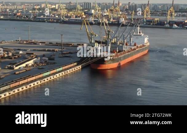 Sea port terminal with cranes. Cargo ship is waiting for loading ...