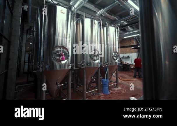 Large steel tanks with beer in industrial brewery plant. Stainless ...