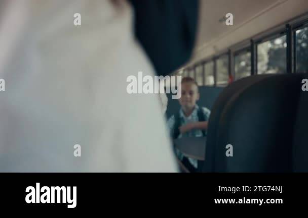 Group diverse pupils boarding sitting school bus after study rear view ...