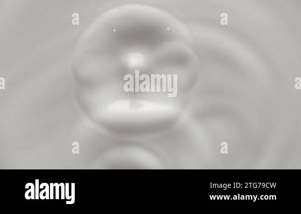 Milk Drop Dripping onto the White Liquid Surface Making Crown and ...